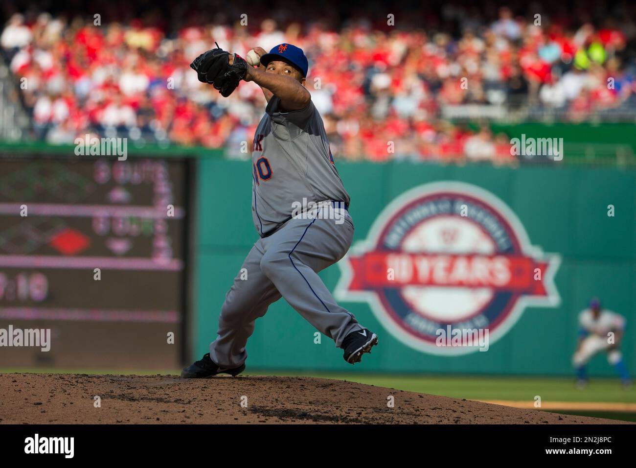 New York Mets starting pitcher Bartolo Colon delivers a pitch against ...