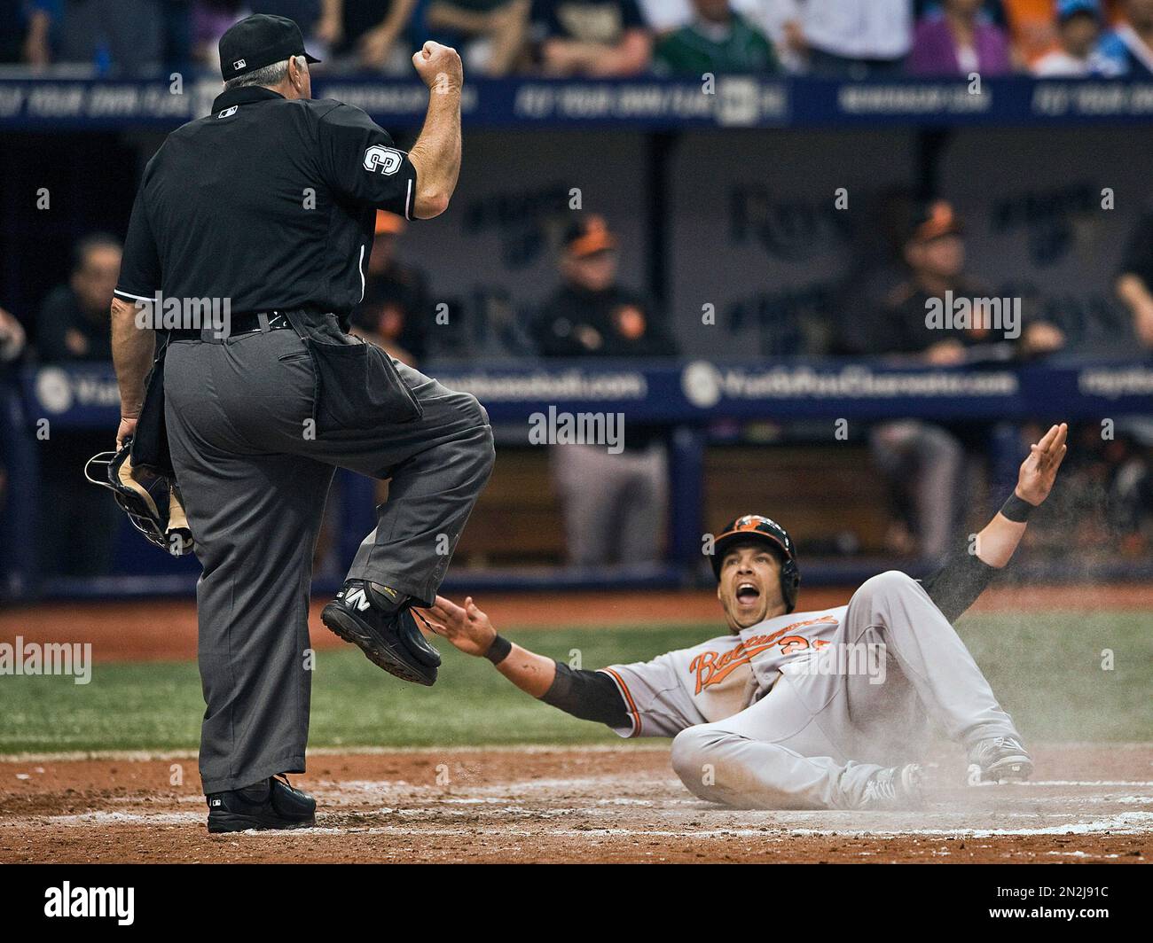 Baltimore Orioles' Steve Pearce signals he was safe on a play at the ...
