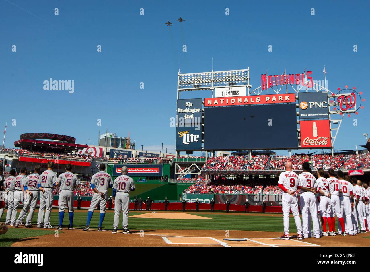 The Washington Nationals and New York Mets watch a flyover before the ...