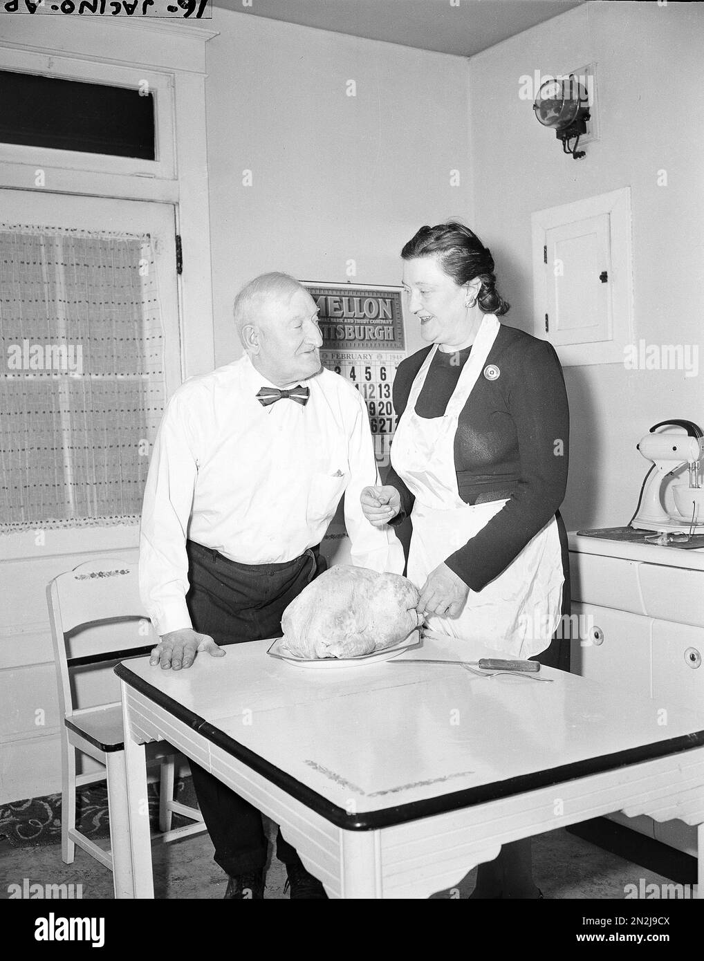 Honus Wagner, baseball's "Flying Dutchman," aids his wife, Bessie, as ...