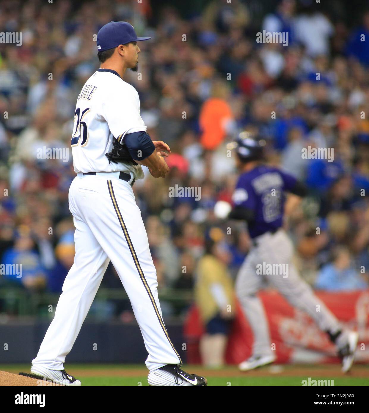 Milwaukee Brewers pitcher Kyle Lohse, left, walks off the mound after ...