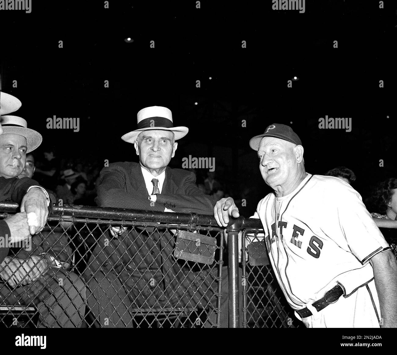 Honus Wagner, right, 71-year-old baseball great, talks things over with ...