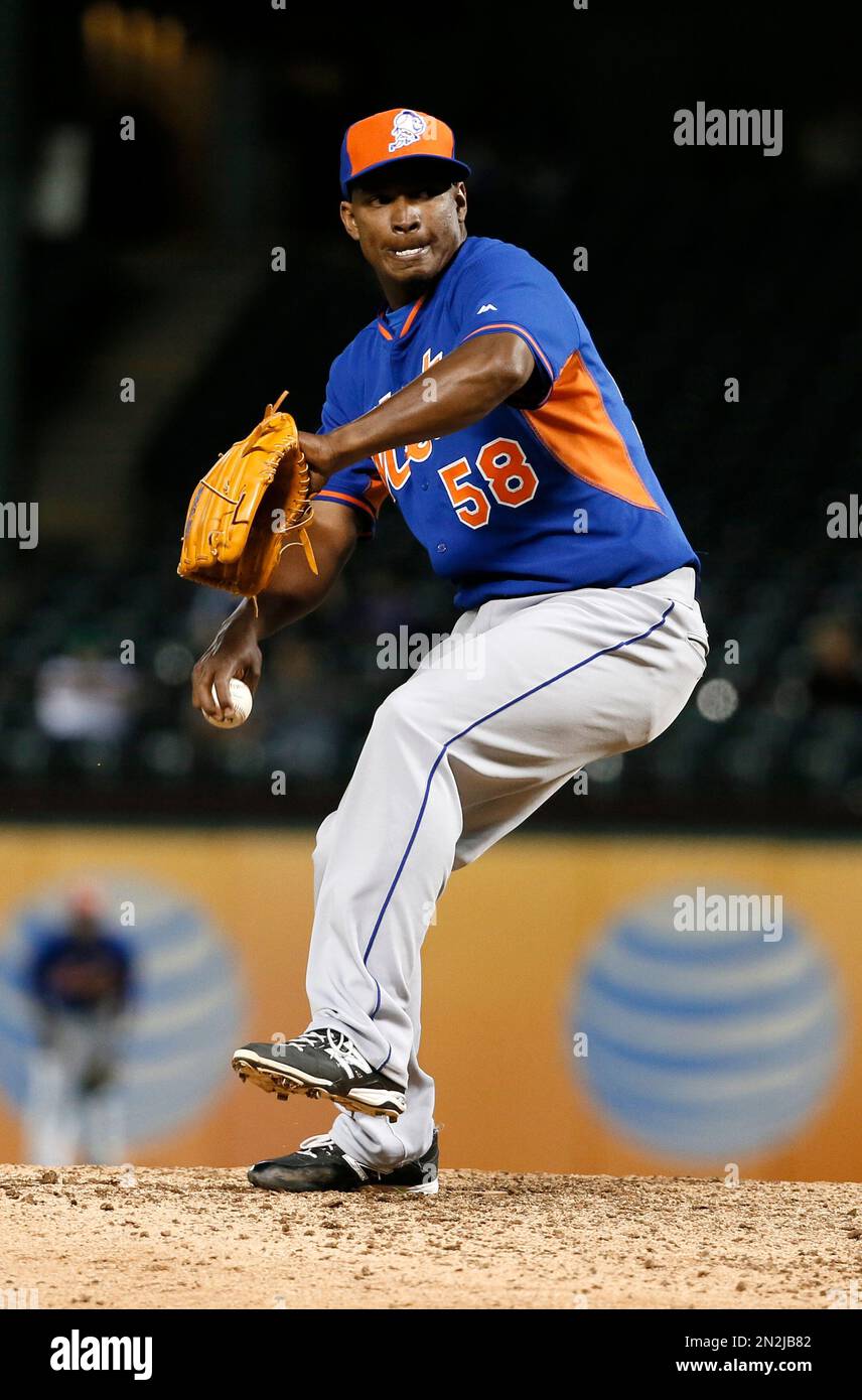 New York Mets' Jenrry Mejia (58) winds up to throw to the Texas Rangers ...