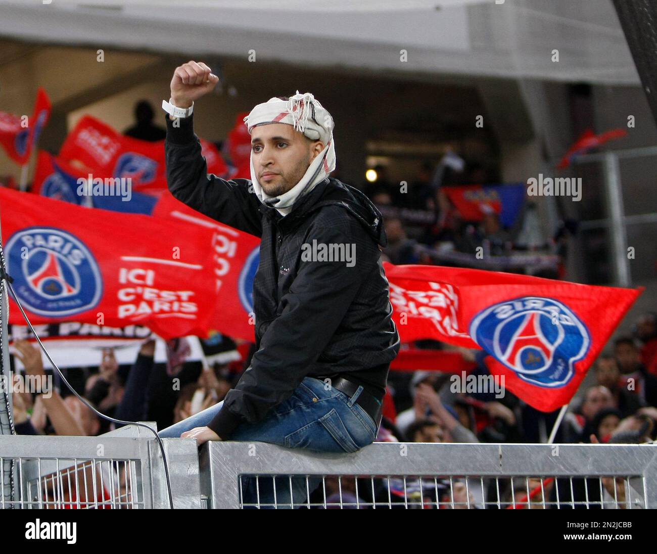 Paris Saint-Germain's supporters hold flags and shouts slogans before ...