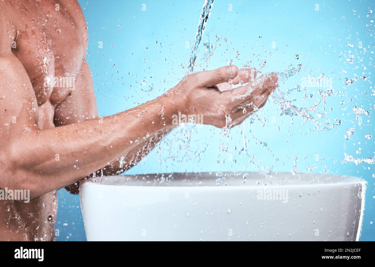 Water splash, washing hands and cleaning man in studio isolated on a ...