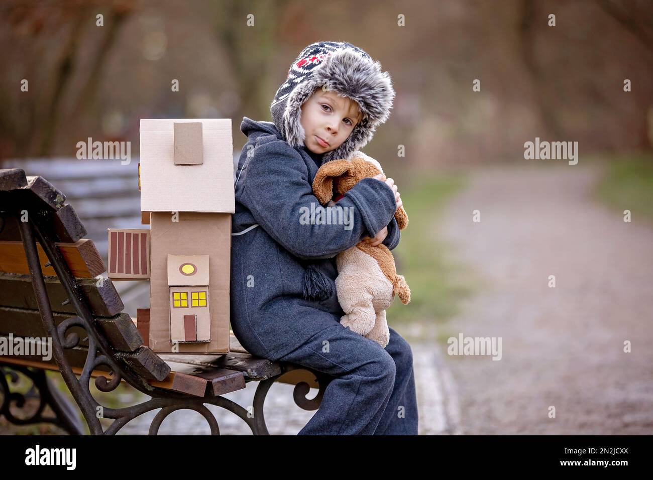 Little child, blond boy with pet dog, carying home on his back, kid ...