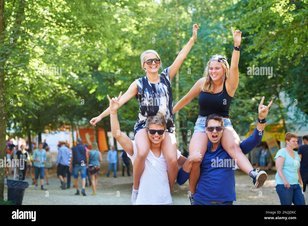Festival vibes. a group of friends having fun together at an outdoor ...