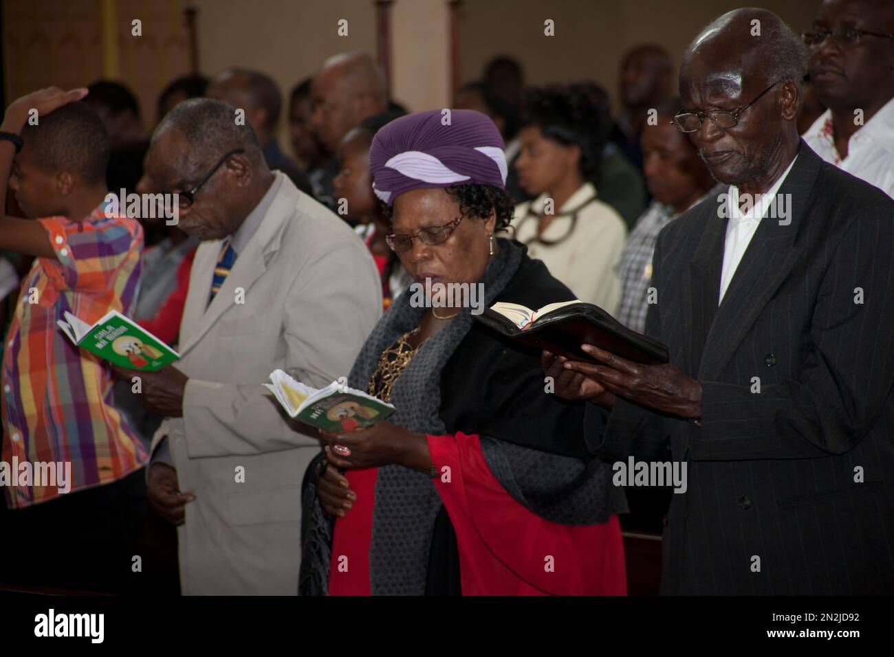 Kenyan Christians pray as they join a morning service at Holy Family ...