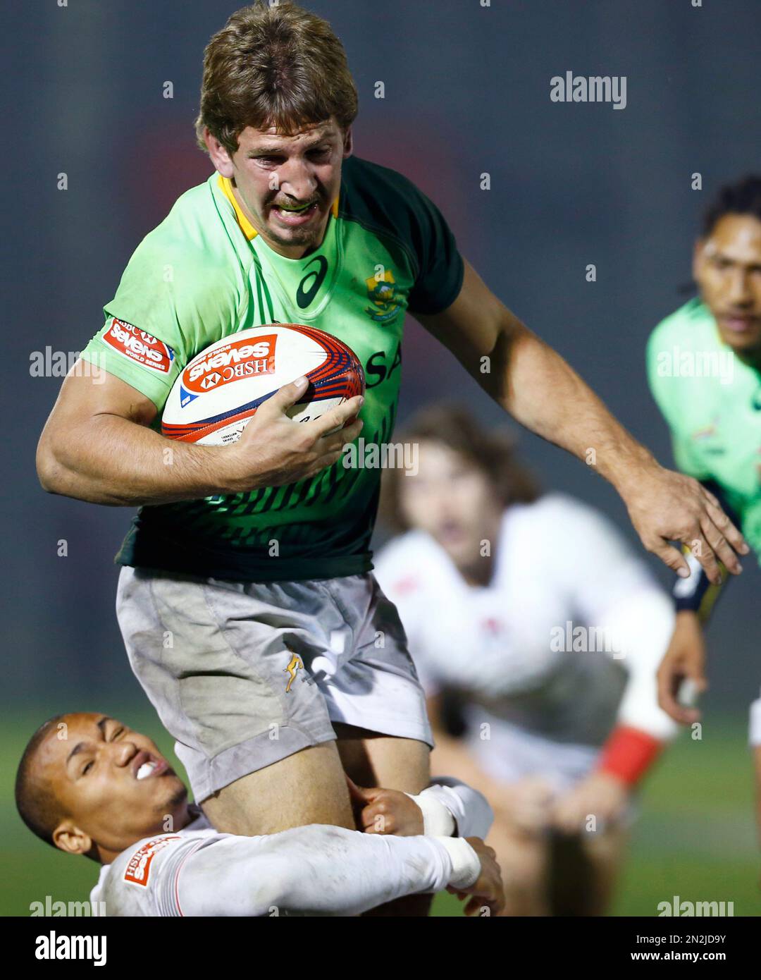 South Africa's Kwagga Smith is tackled by England's Marcus Watson ...