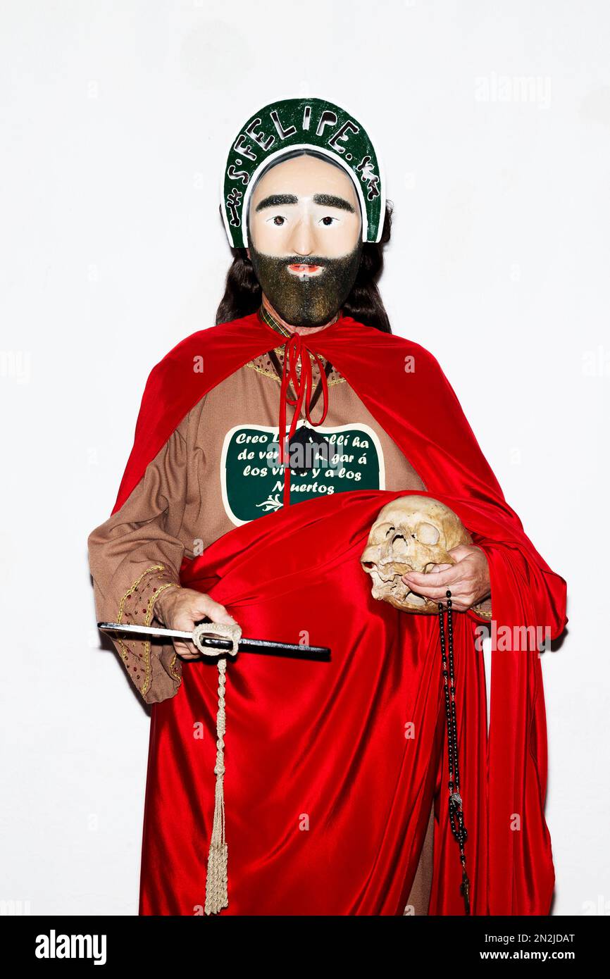 A penitent poses for a picture dressed with typical Apostle dress ...