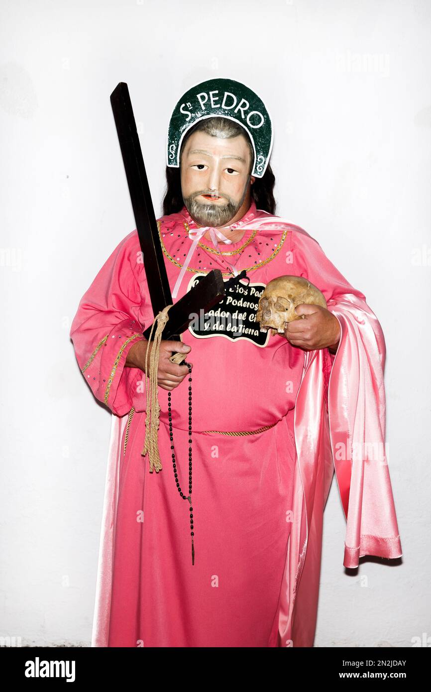 A penitent poses for a picture dressed with typical Apostle dress ...