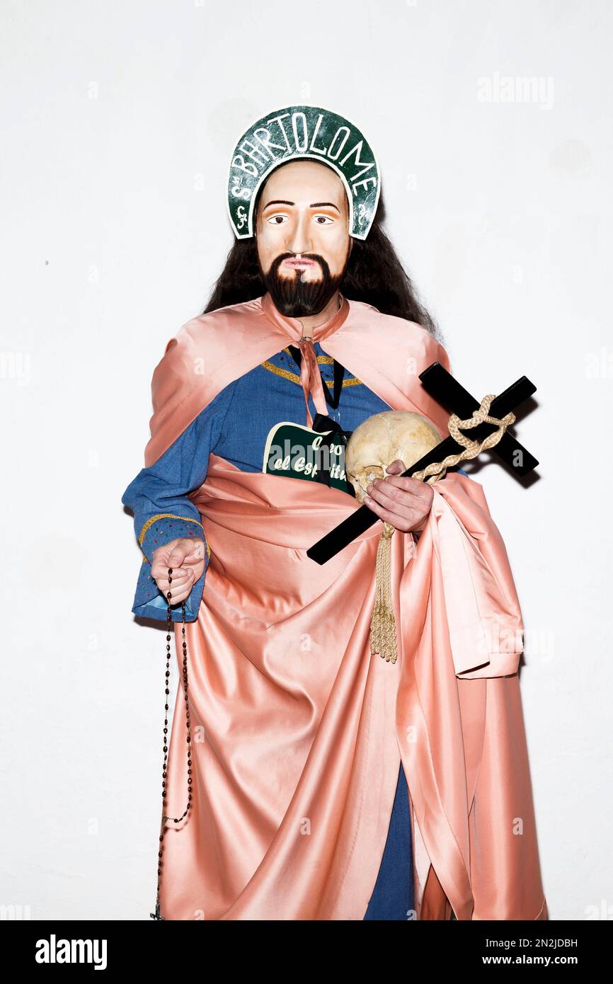 A penitent poses for a picture dressed with typical Apostle dress ...