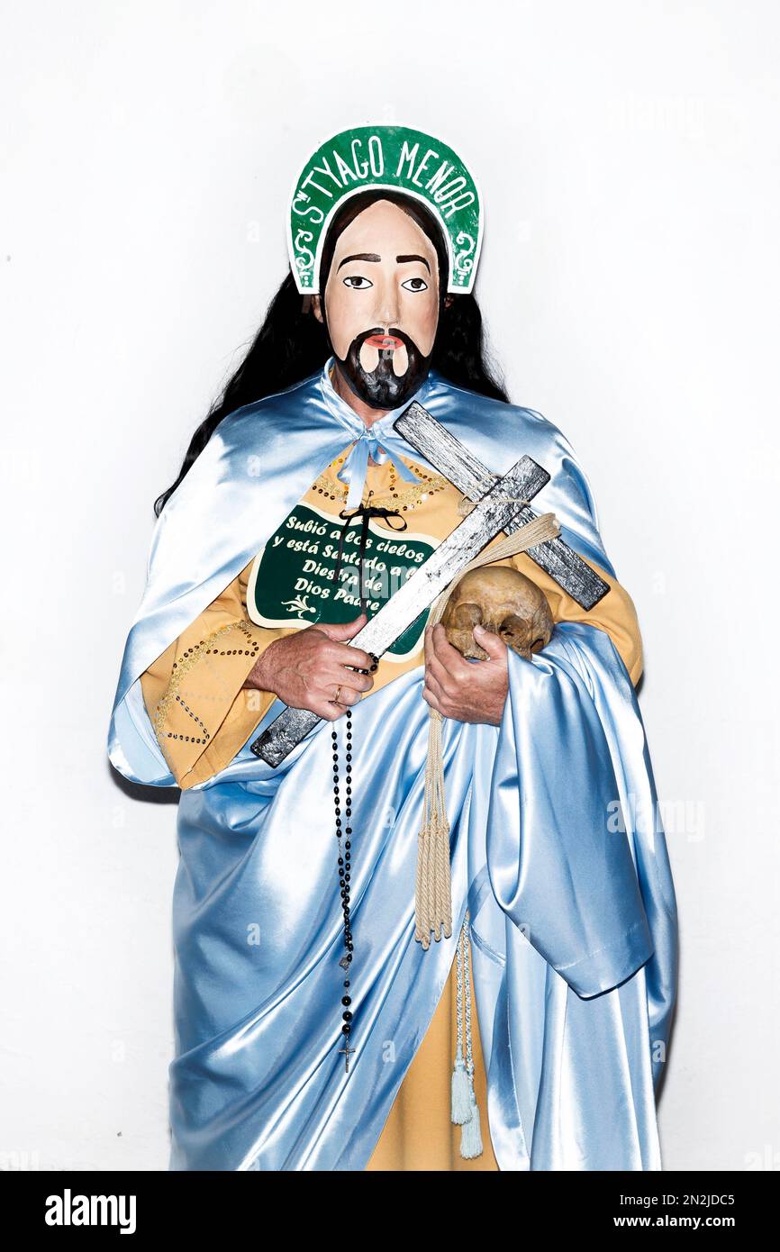 A penitent poses for a picture dressed with typical Apostle dress ...