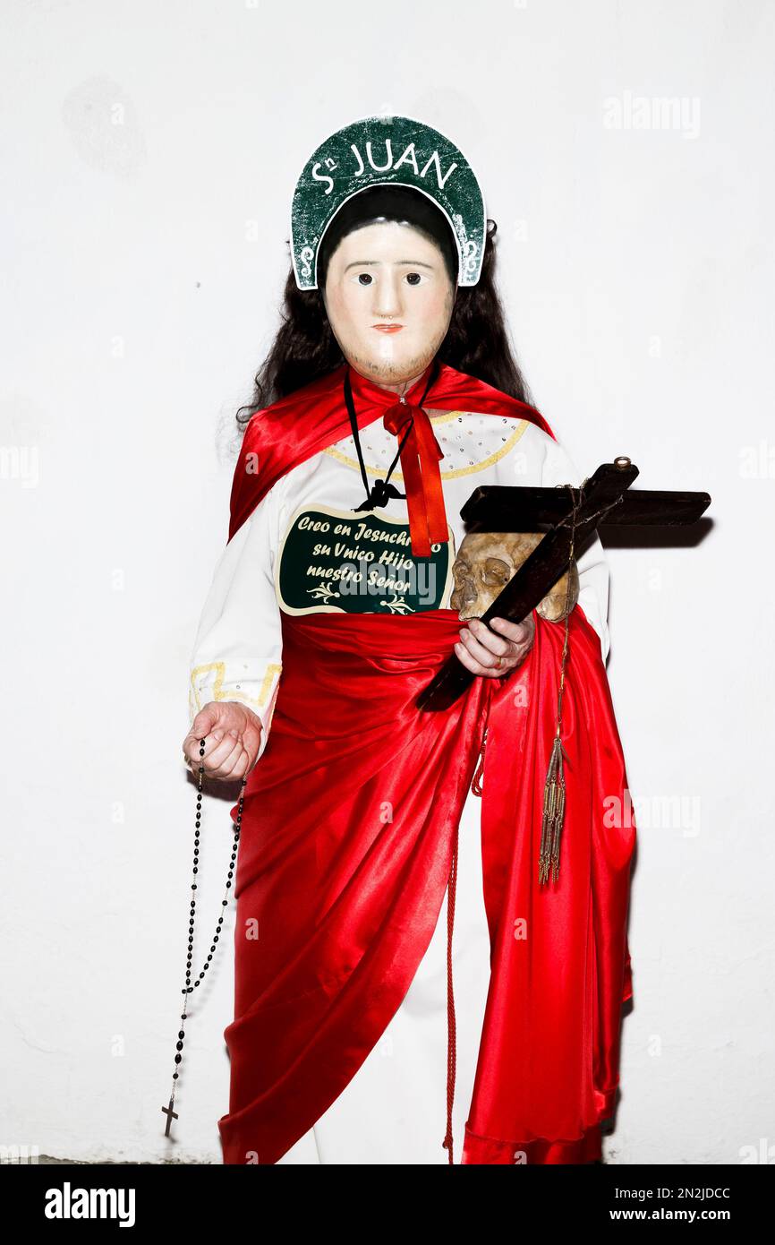 A penitent poses for a picture dressed with typical Apostle dress ...