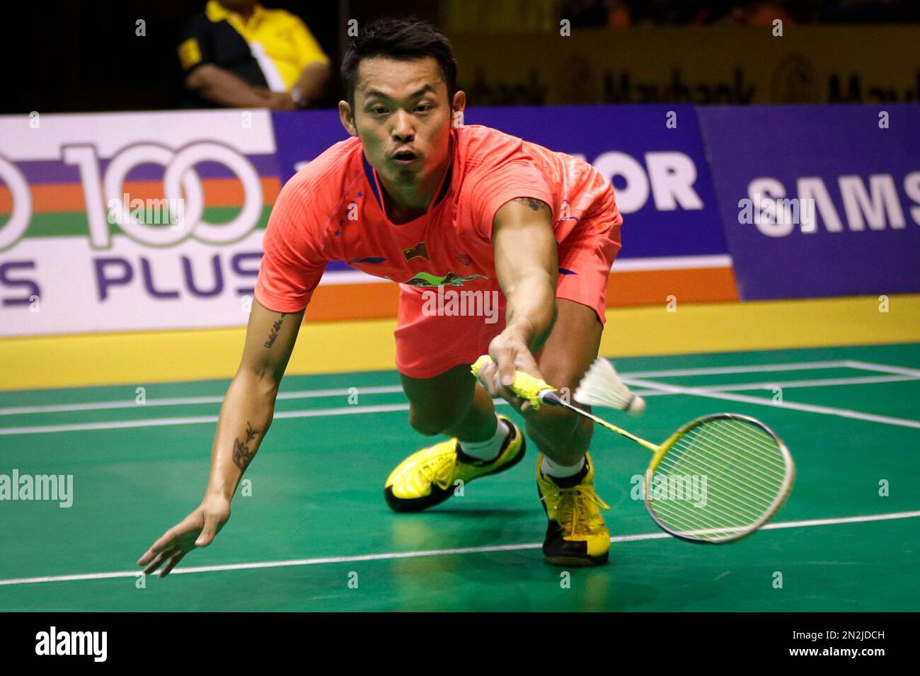 China's Lin Dan returns a shot from his compatriot Chen Long during ...