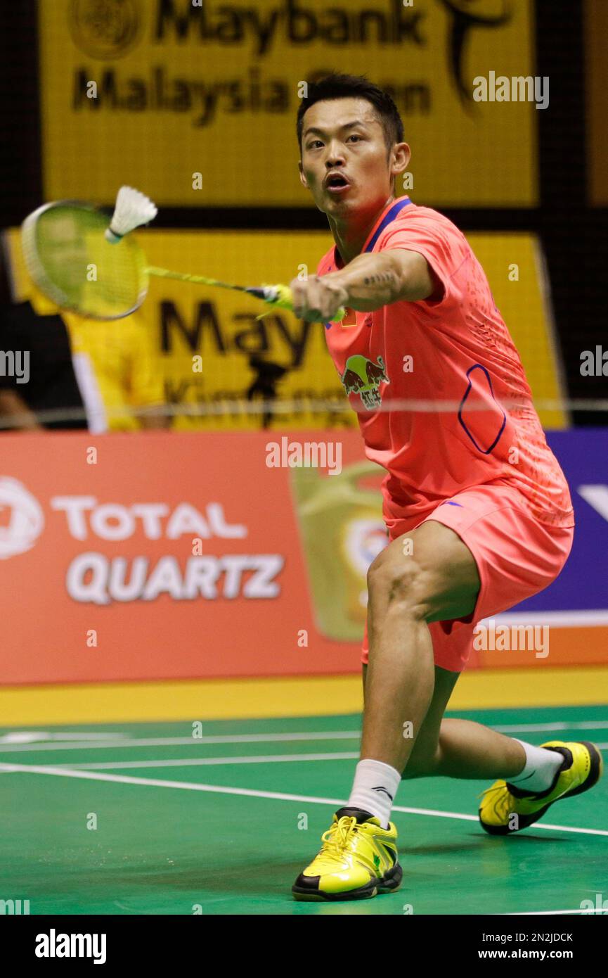 China's Lin Dan returns a shot from his compatriot Chen Long during ...