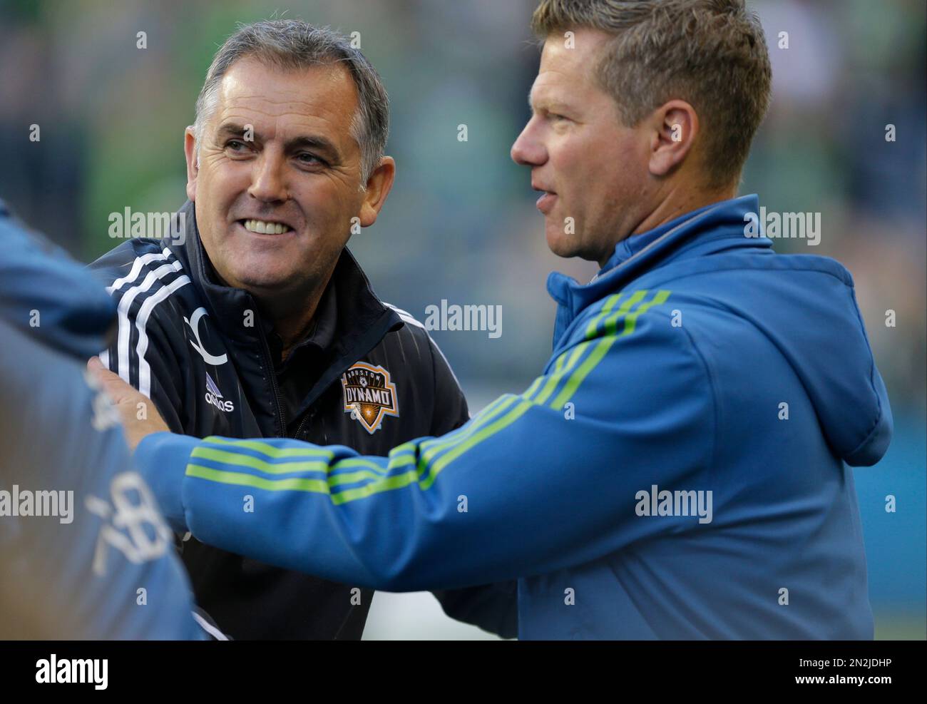 Houston Dynamo head coach Owen Coyle, left, greets David Tenney, right ...