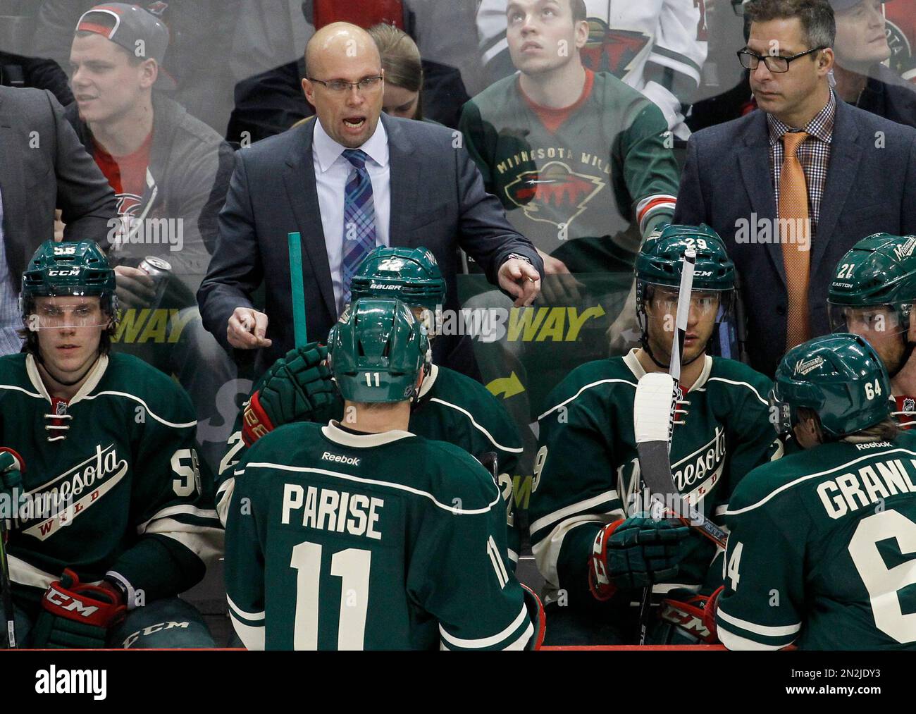 Minnesota Wild head coach Mike Yeo talks with his players during the ...