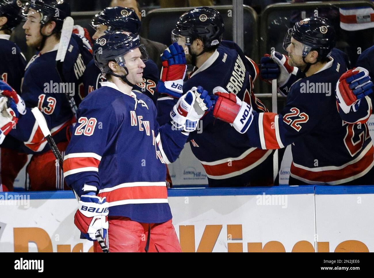 New York Rangers' Dominic Moore (28) celebrates a goal by teammate Dan ...