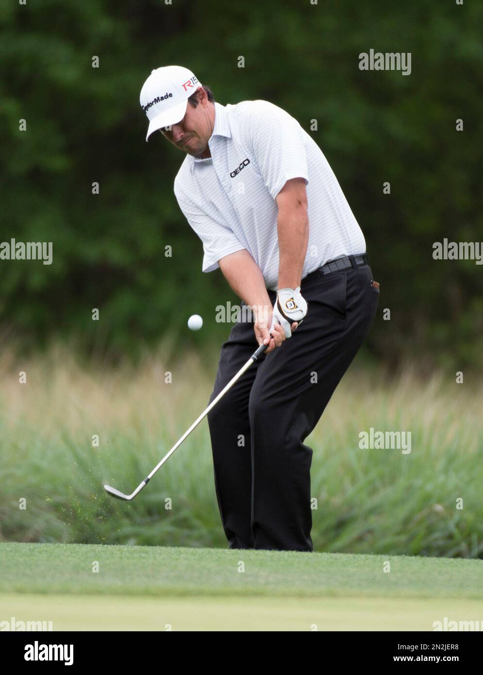 Johnson Wagner pitches onto the ninth green during the third round of ...