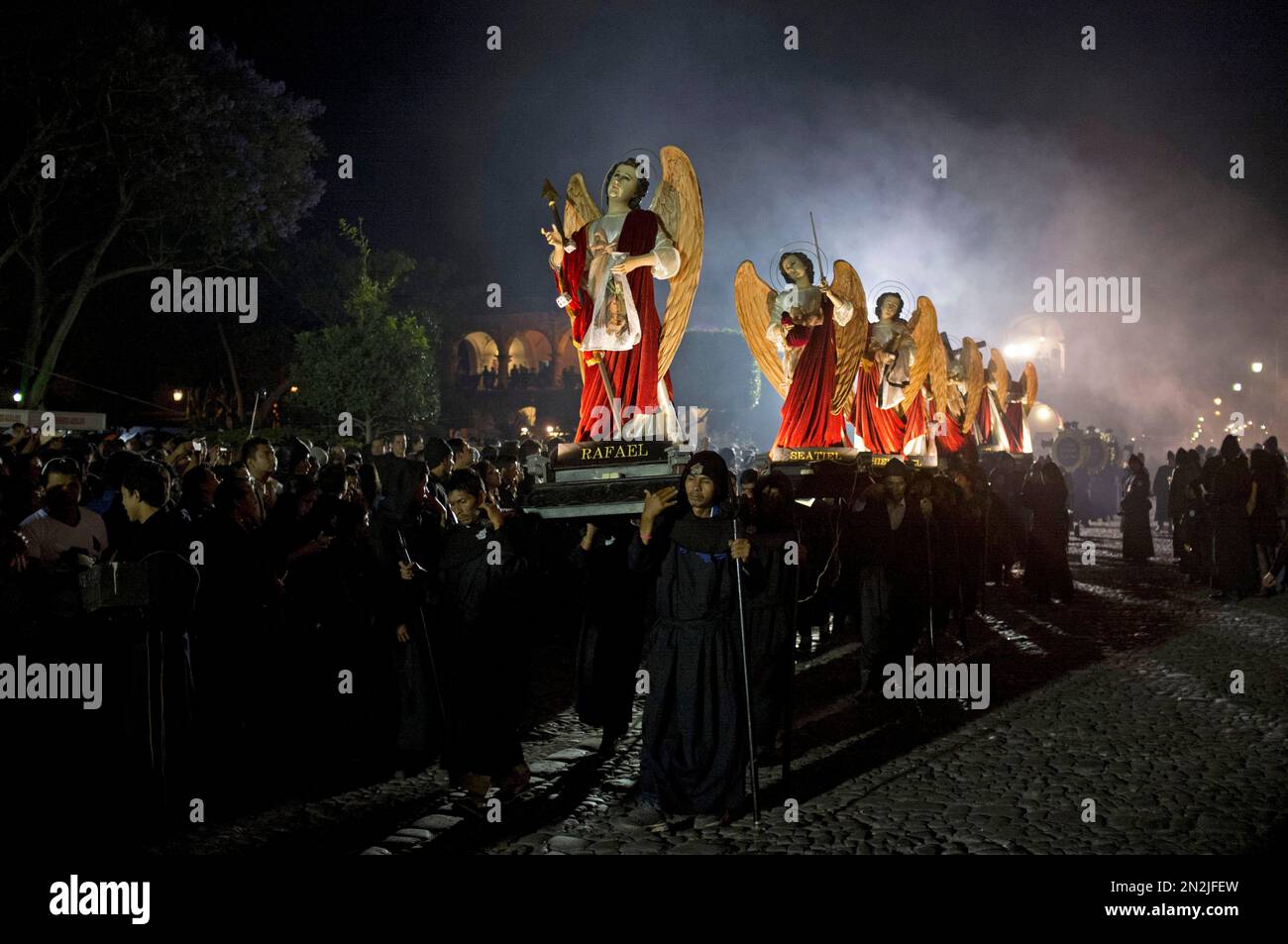 Penitents carry religious floats holding statues representing the seven ...
