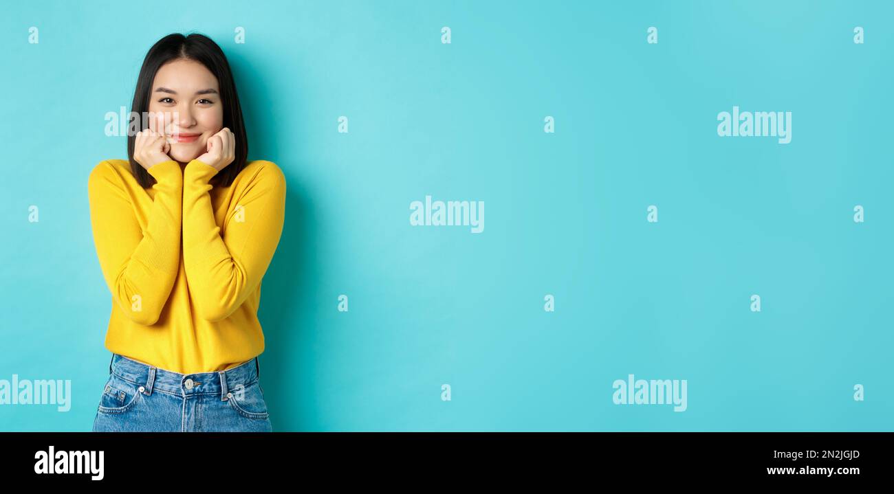 Beauty and fashion concept. Beautiful asian woman blushing and smiling ...