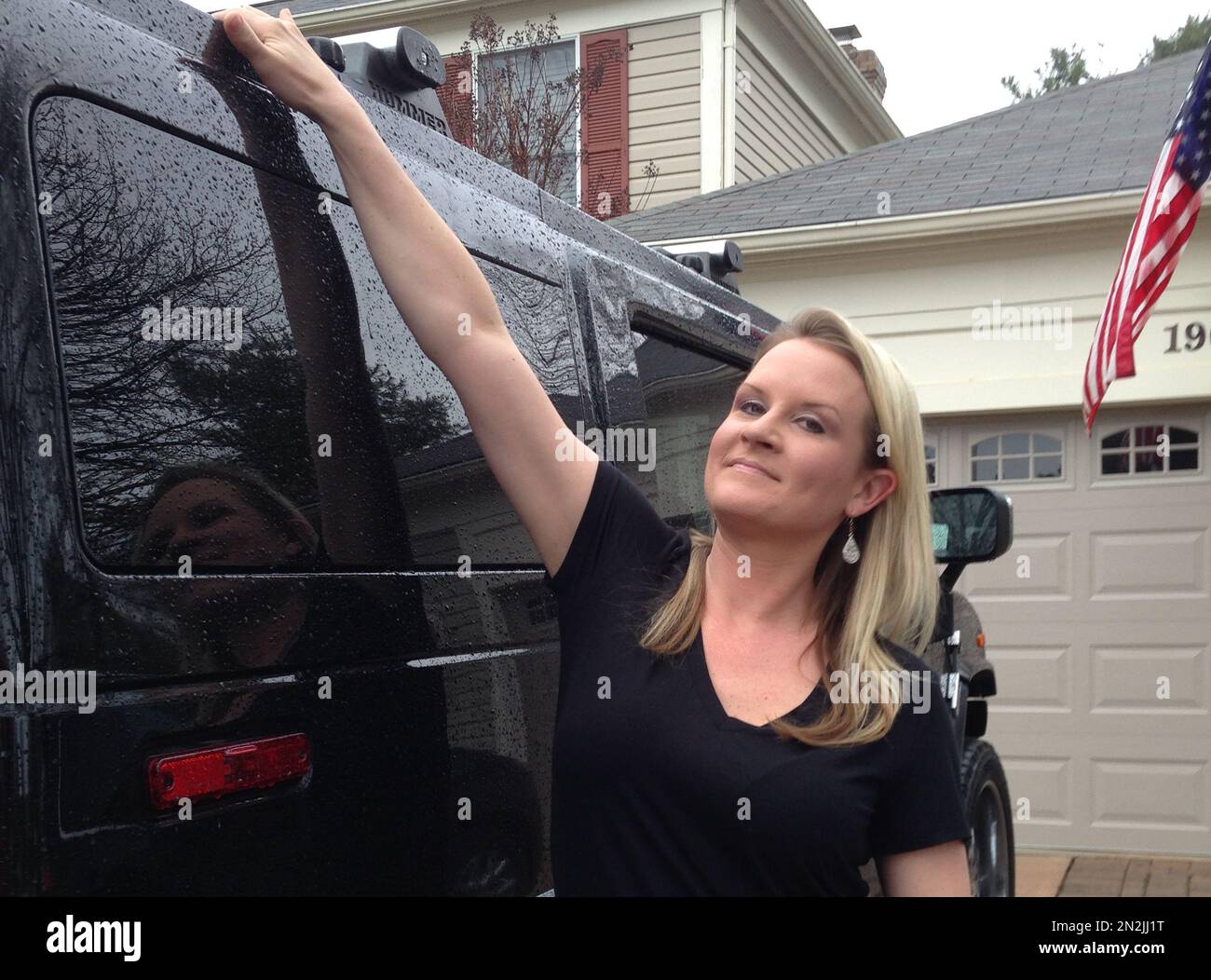Ella May Rudd points to a leaky spot on her Hummer H2, parked in her ...