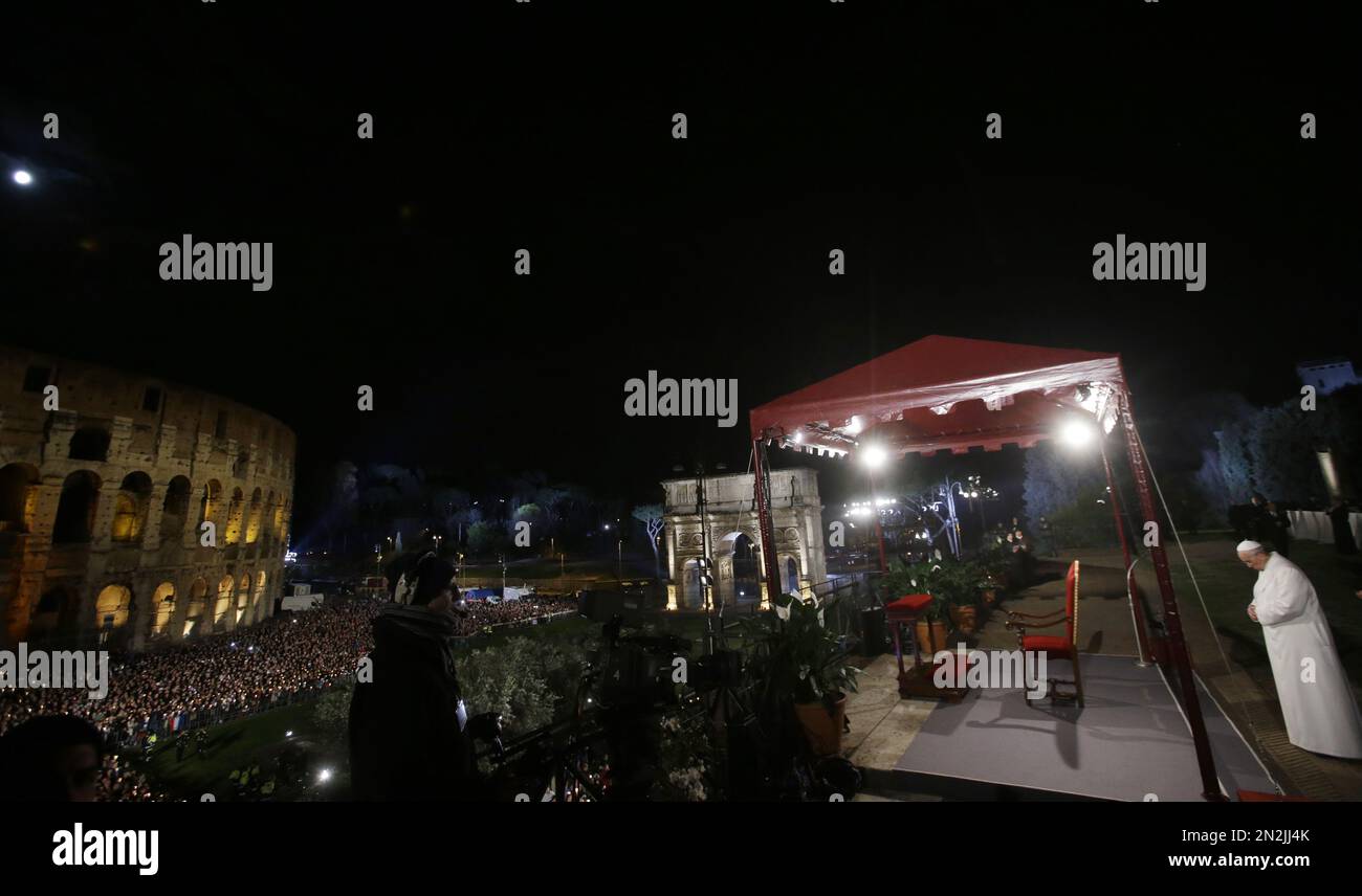 Pope Francis arrives in front of the Colosseum as a full moon rises ...