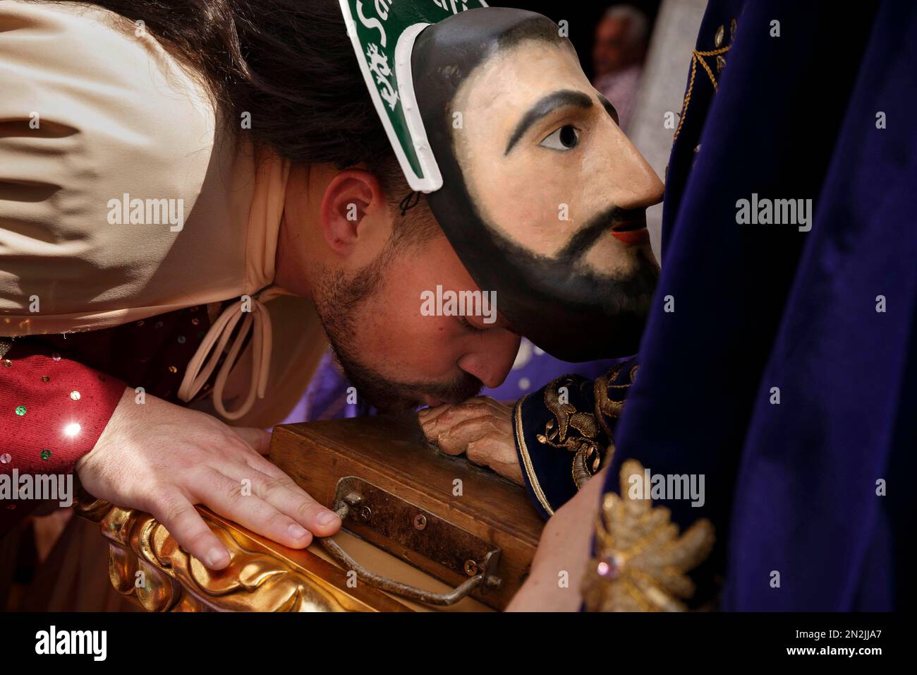 A penitent wearin the traditional 'rostrillo' or little face depicting ...