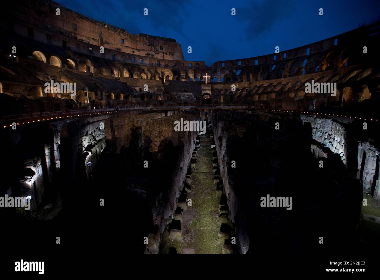 A cross is lighten before the start of the Via Crucis (Way of the Cross ...