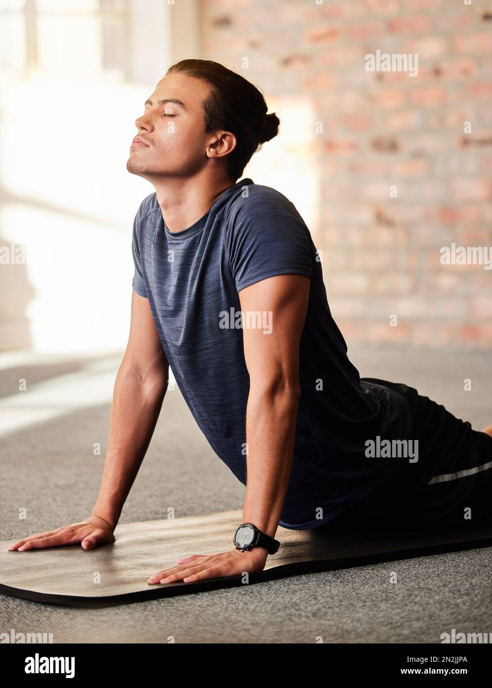 Muscular young bodybuilder in relaxed hi-res stock photography and ...