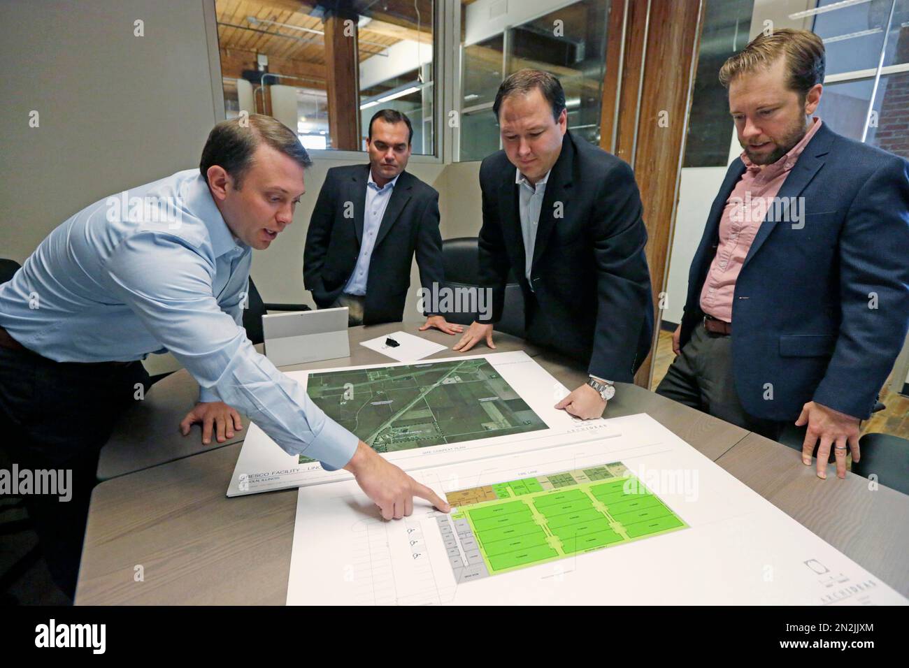 In this March 31, 2015 photo, from left, Dominic Sergi, Rob Sampson ...