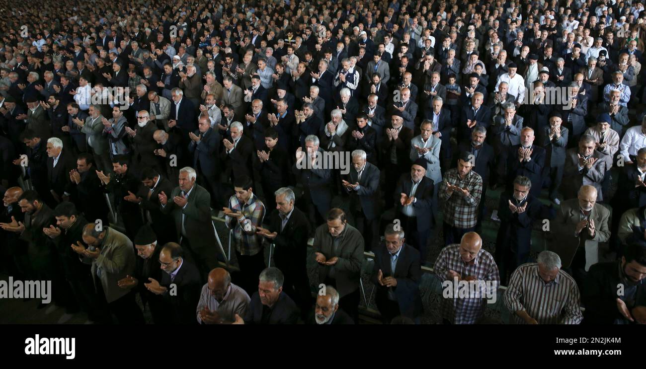 Iranian worshippers pray during Friday prayers at the Tehran university ...