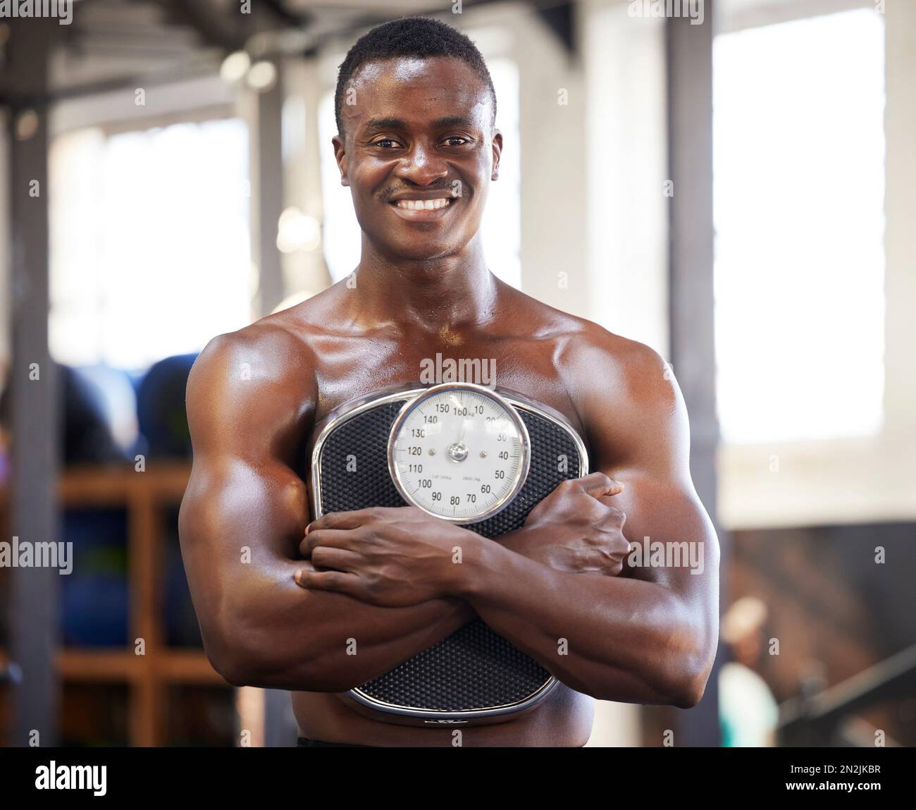 Black man, bodybuilder and gym for portrait with weight scale for ...