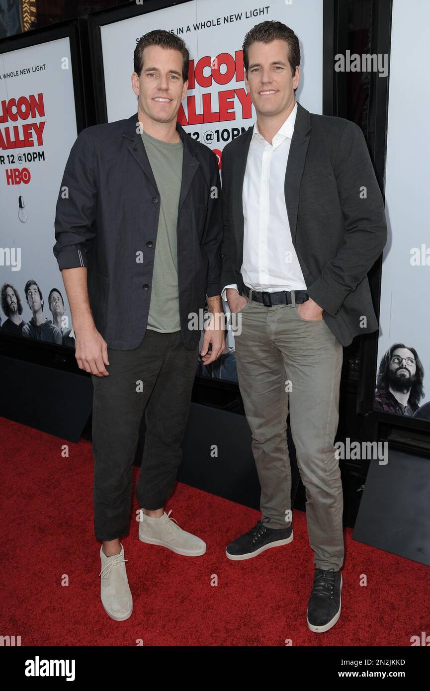 Cameron Winklevoss, left, and Tyler Winklevoss arrive at the LA ...