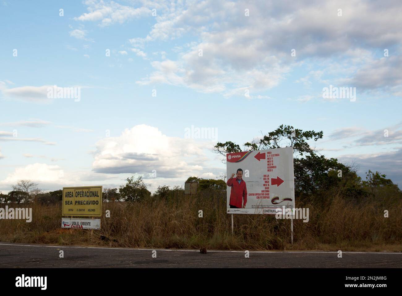 In this Feb. 18, 2015 photo, a road sign pointing to oil fields ...