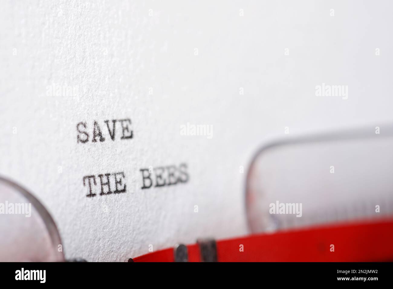 Save the bees text written with a typewriter Stock Photo - Alamy