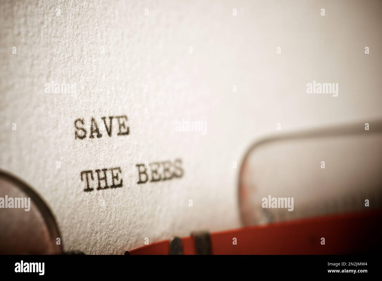 Save the bees text written with a typewriter Stock Photo - Alamy