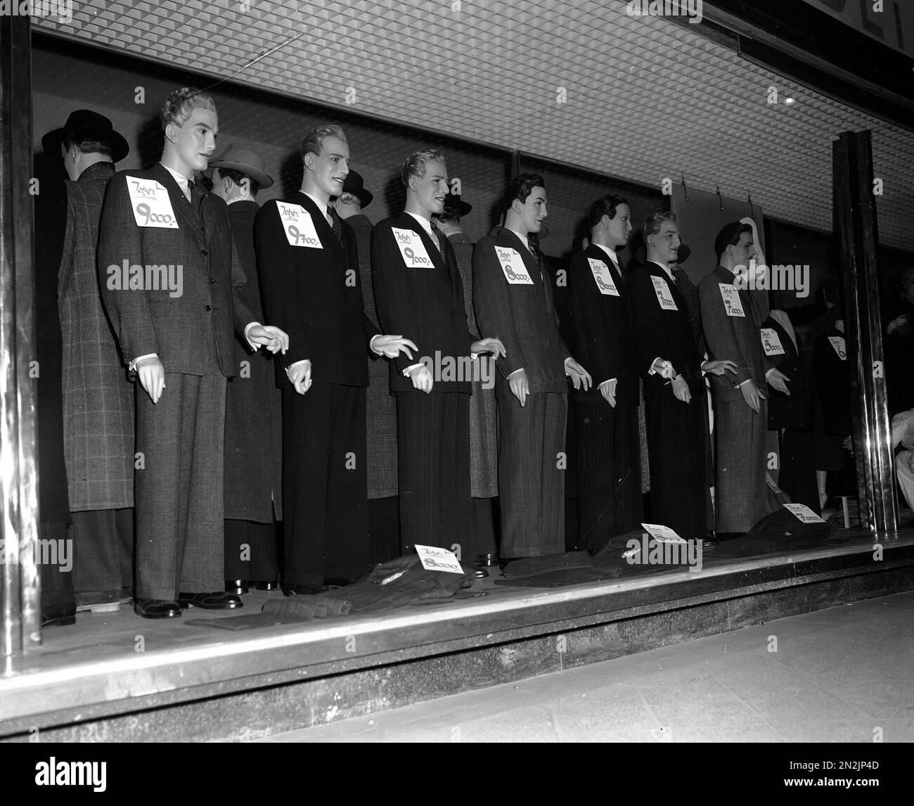 Mannequins dressed in French-made men's suits are displayed in soldier ...