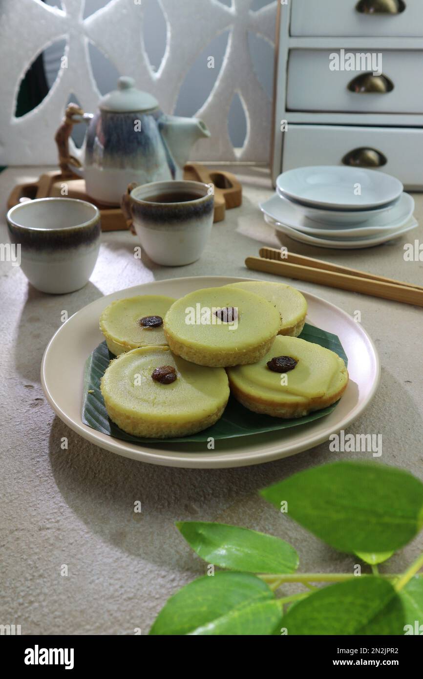 serving of potato cakes against the background of a tea set and white ...