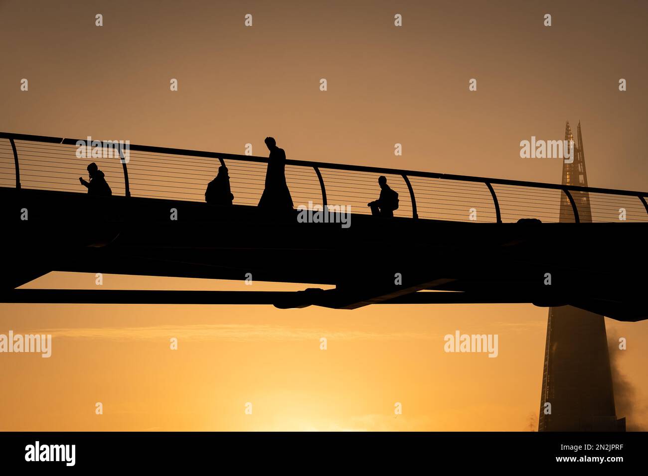 The sun rises behind Millennium Bridge, London. Picture date: Tuesday ...