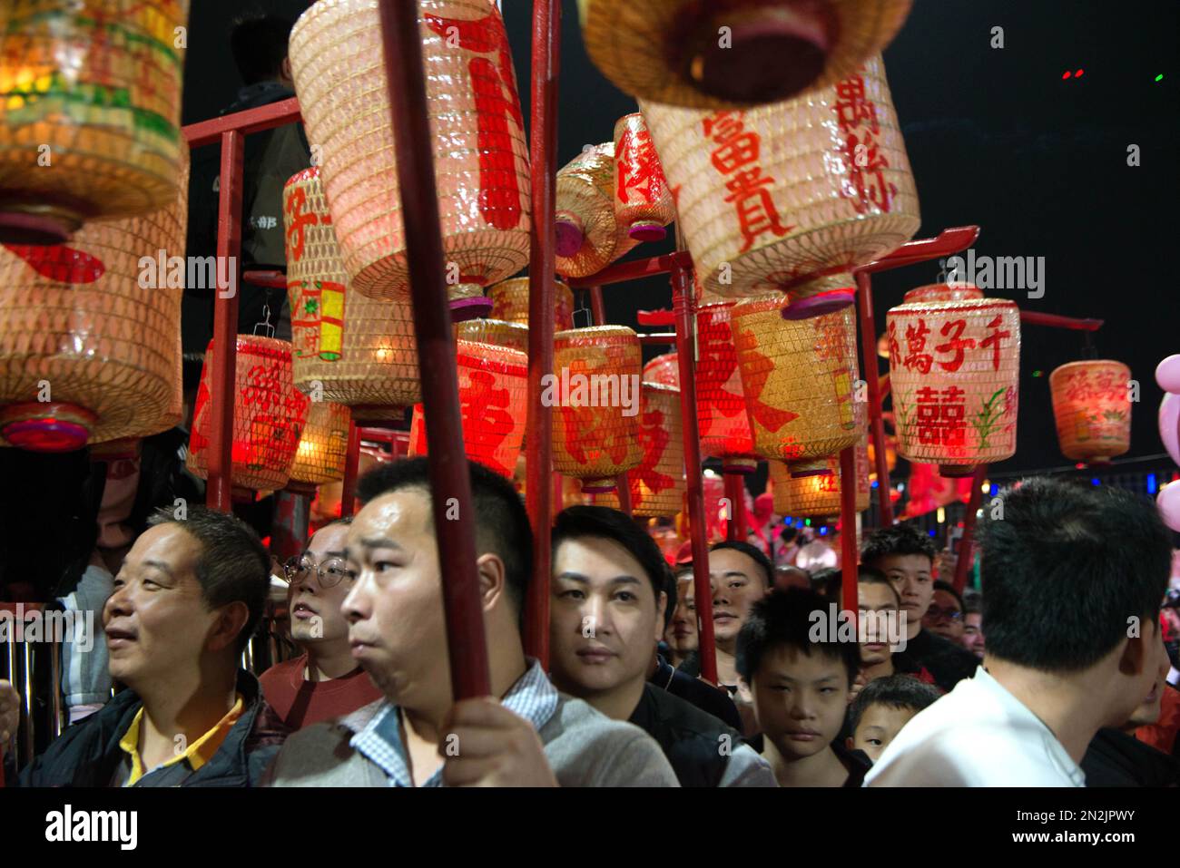About ten thousand people take part in a lantern parade to celebrate ...