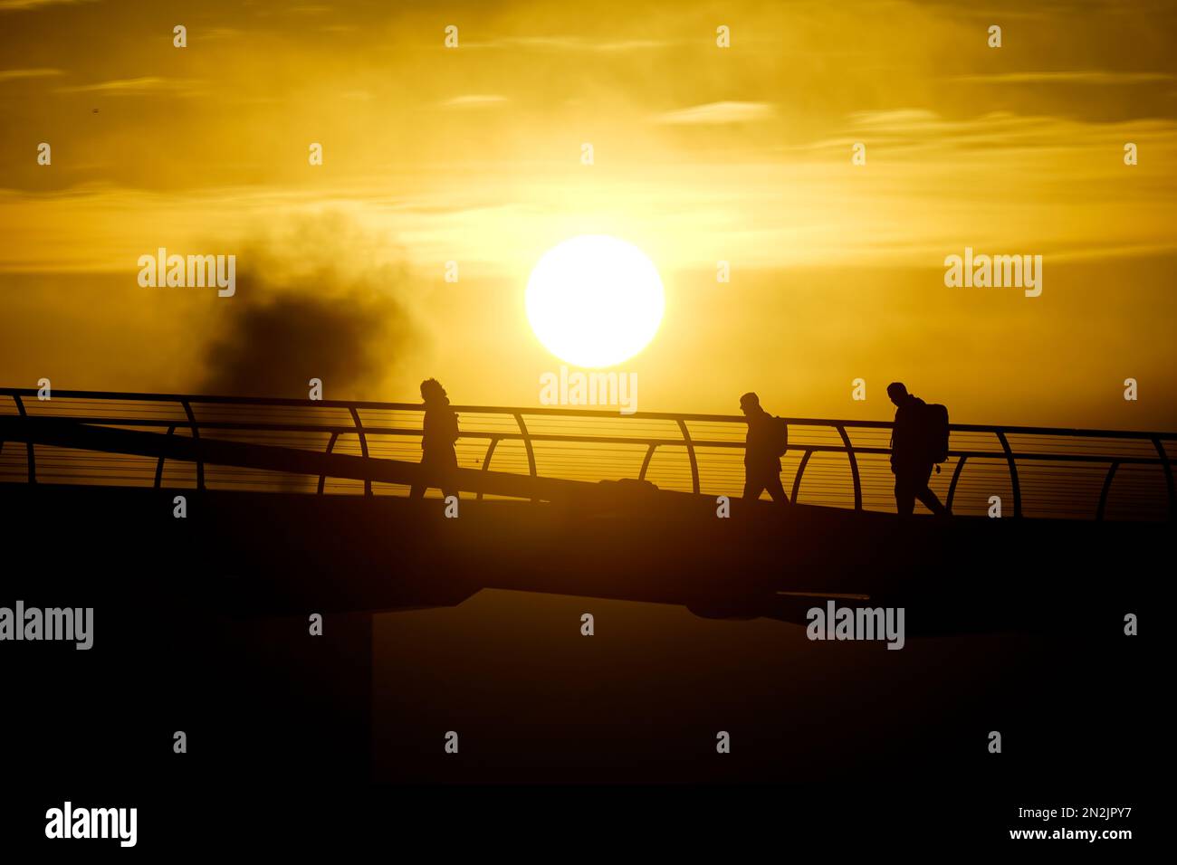 The sun rises behind Millennium Bridge, London. Picture date: Tuesday ...