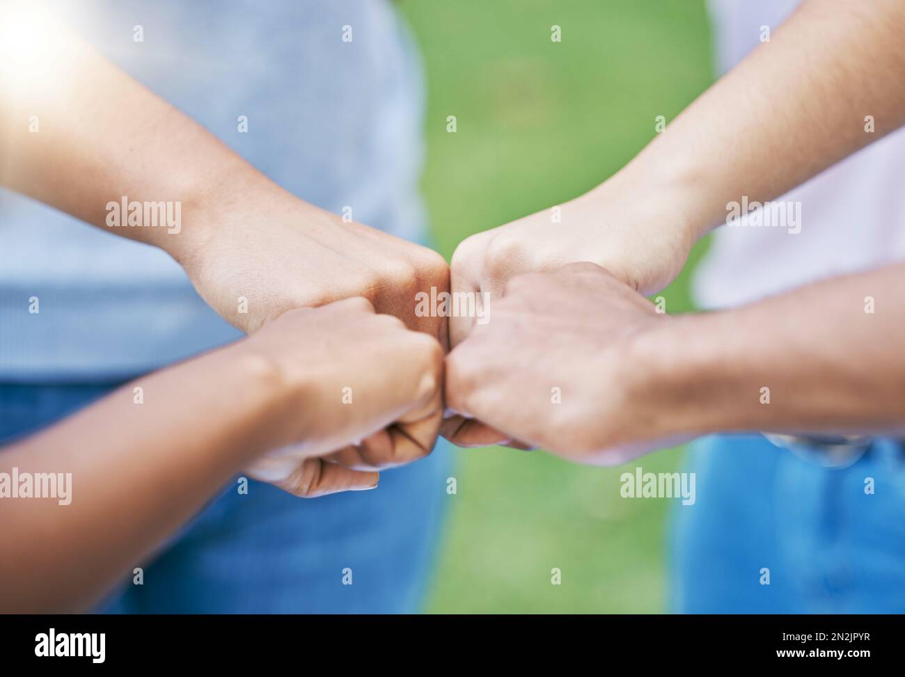 People, hands and fist bump in collaboration for community, partnership ...