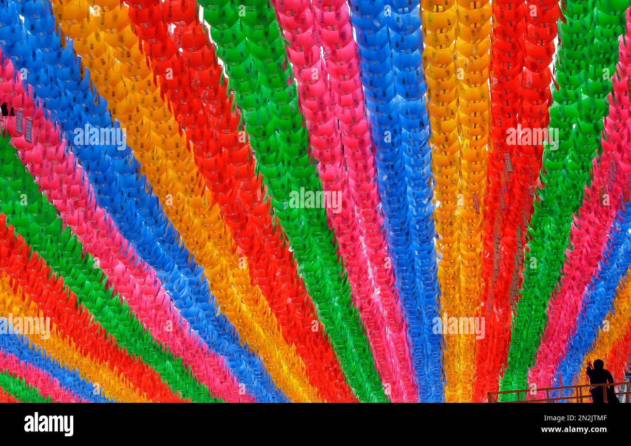 A worker attaches the name tag of a Buddhist who made donation to a ...