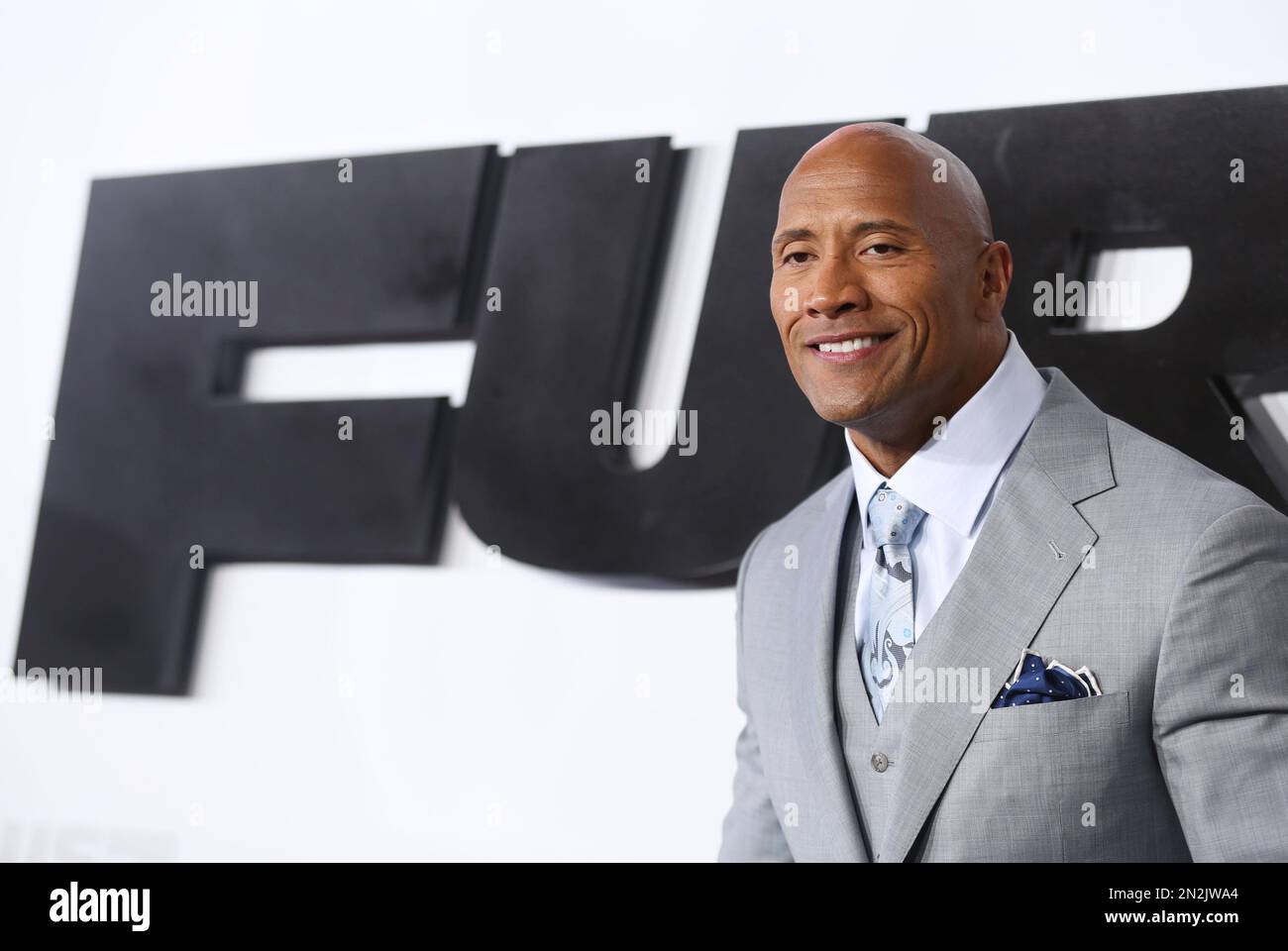 Dwayne "The Rock" Johnson arrives at the premiere of "Furious 7" at the ...
