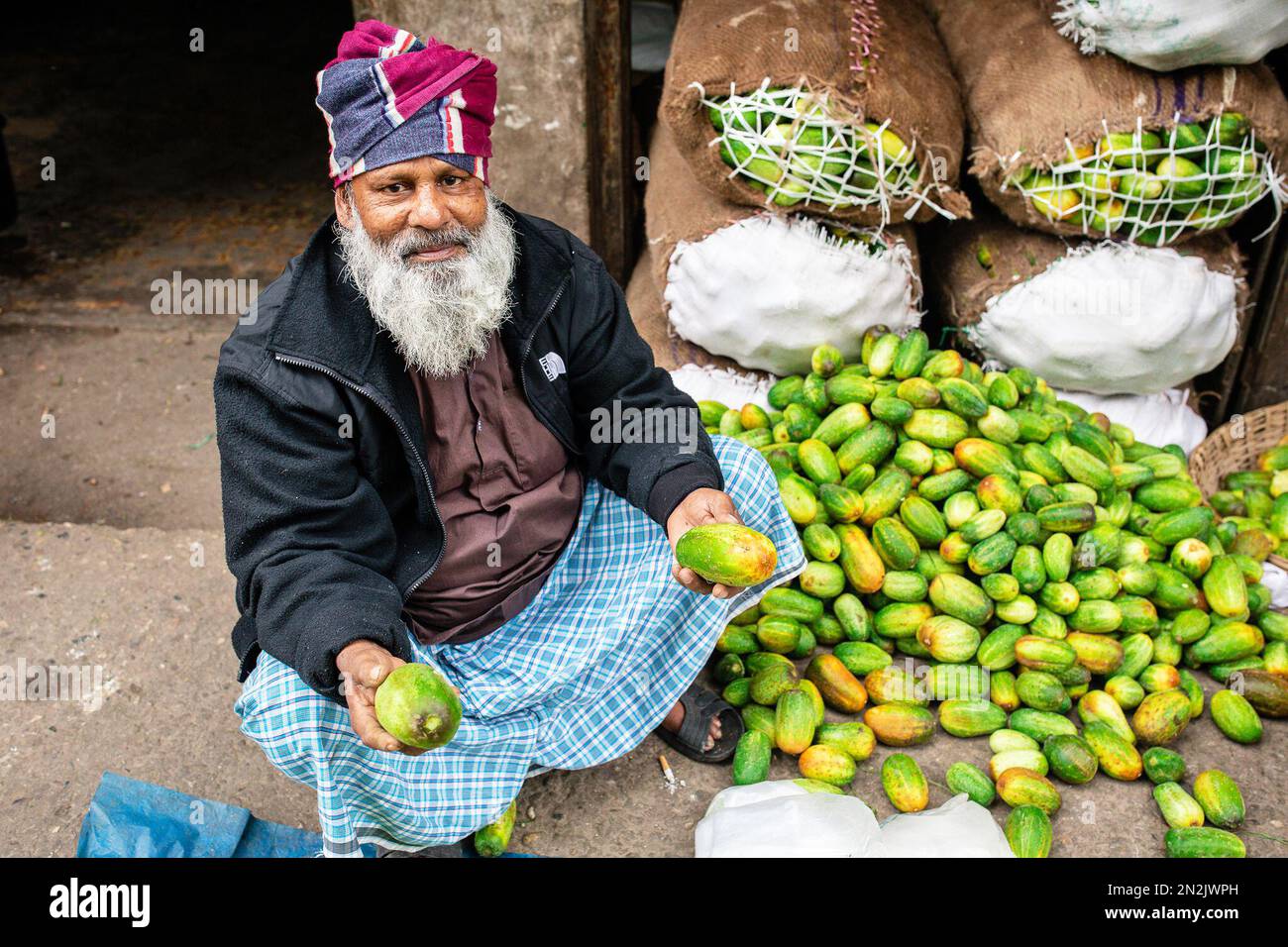 Dhaka, Dhaka, Bangladesh. 7th Feb, 2023. A cucumber seller at a market ...