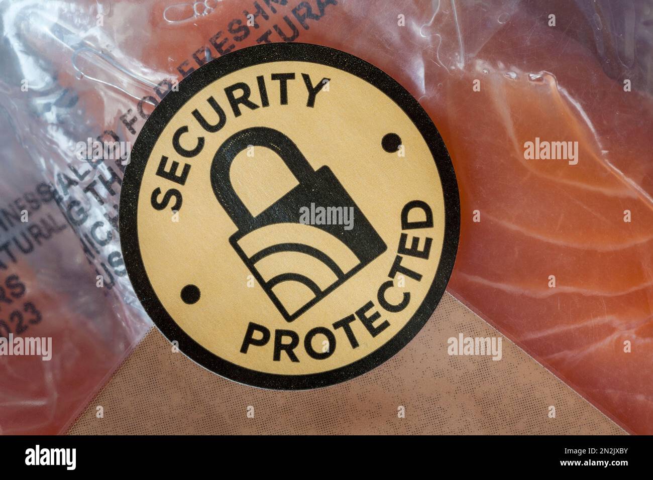 Security protected label sticker on packet of salmon from M&S Stock ...