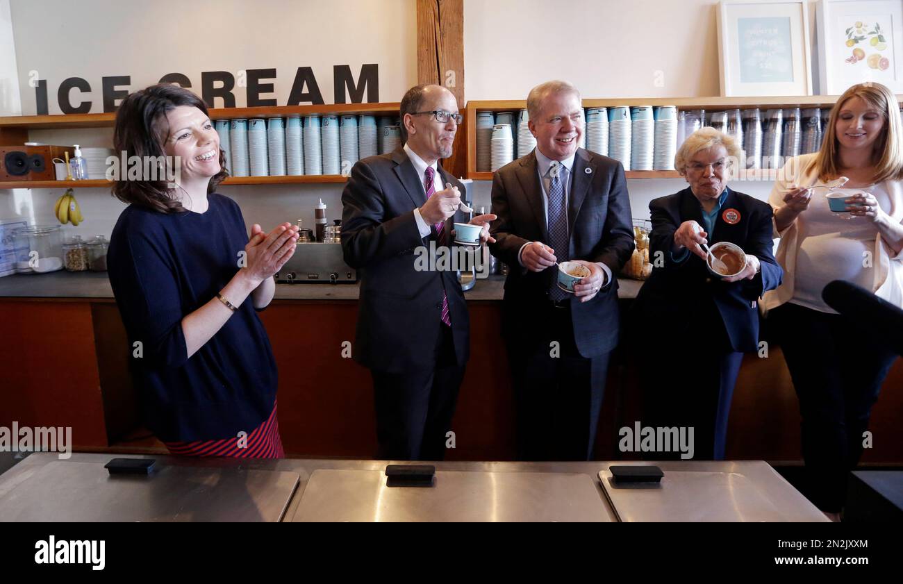 Ice cream shop owner Molly Moon Neitzel, left, smiles as U.S. Secretary ...