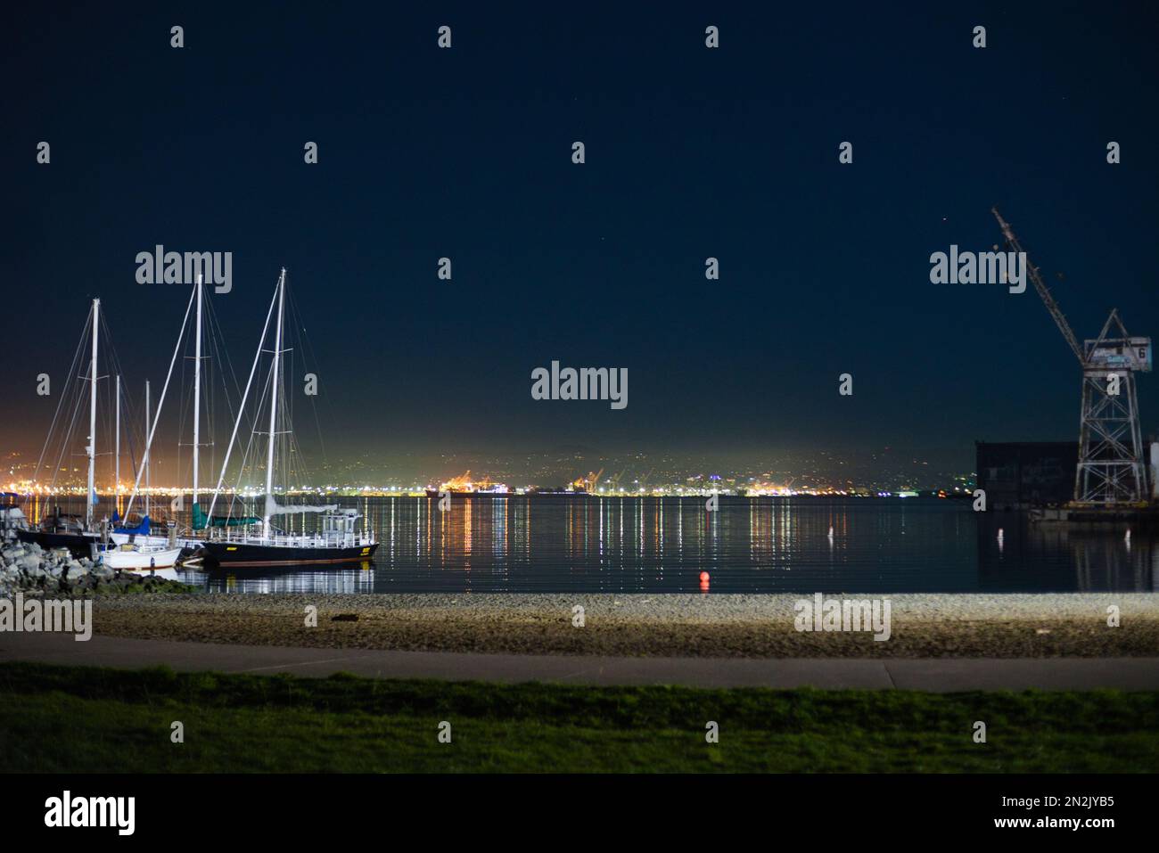 Crane Cove Park at night looking across the water of San Francisco Bay ...